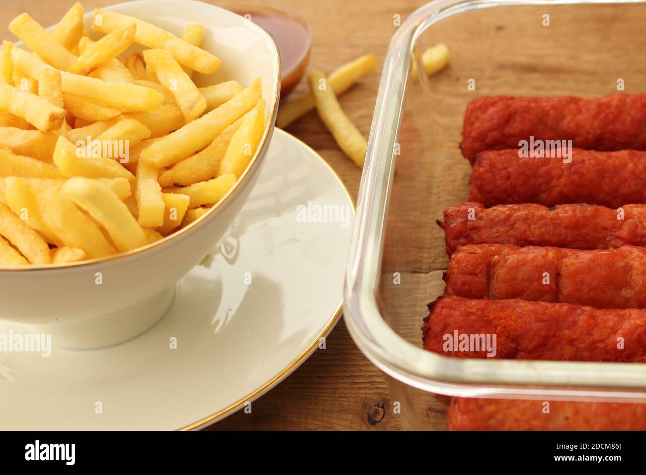 delicious french fries with cevapcici rolls and dip Stock Photo - Alamy