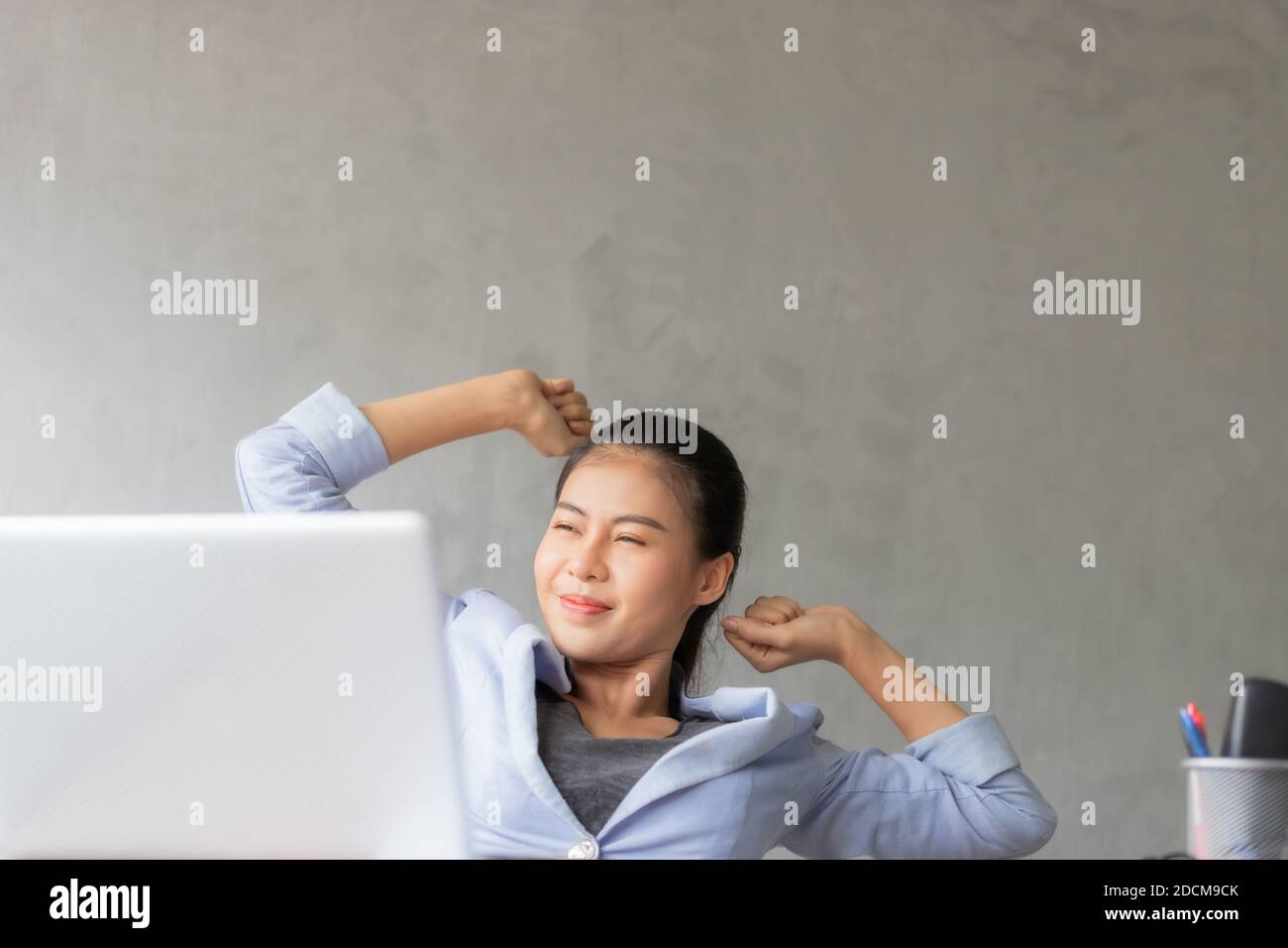 Business women or working lady are stretch oneself or lazily for ...