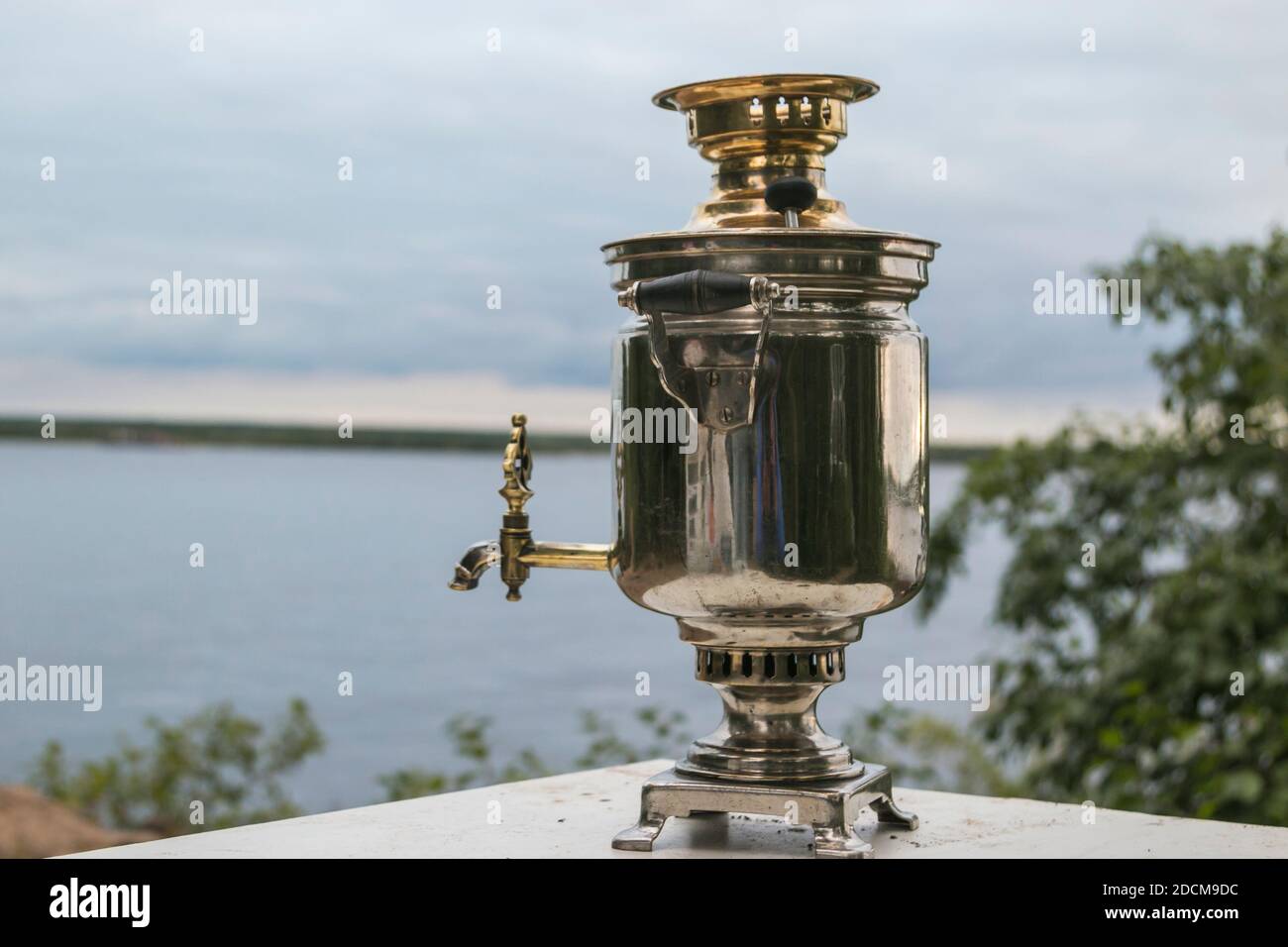 Beautiful shiny samovar on a background of water Stock Photo - Alamy