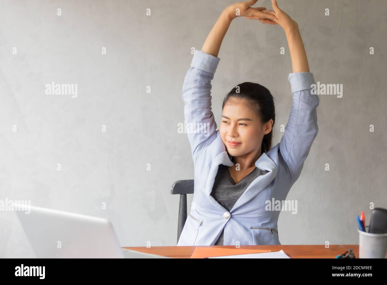 Business women or working lady are stretch oneself or lazily for ...