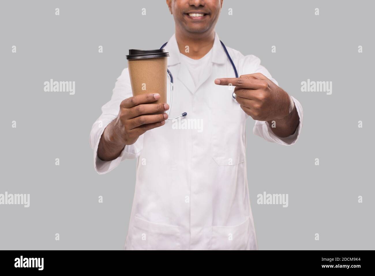 Doctor Pointing at Coffee Take Away Cup Smiling Close Up Isolated ...