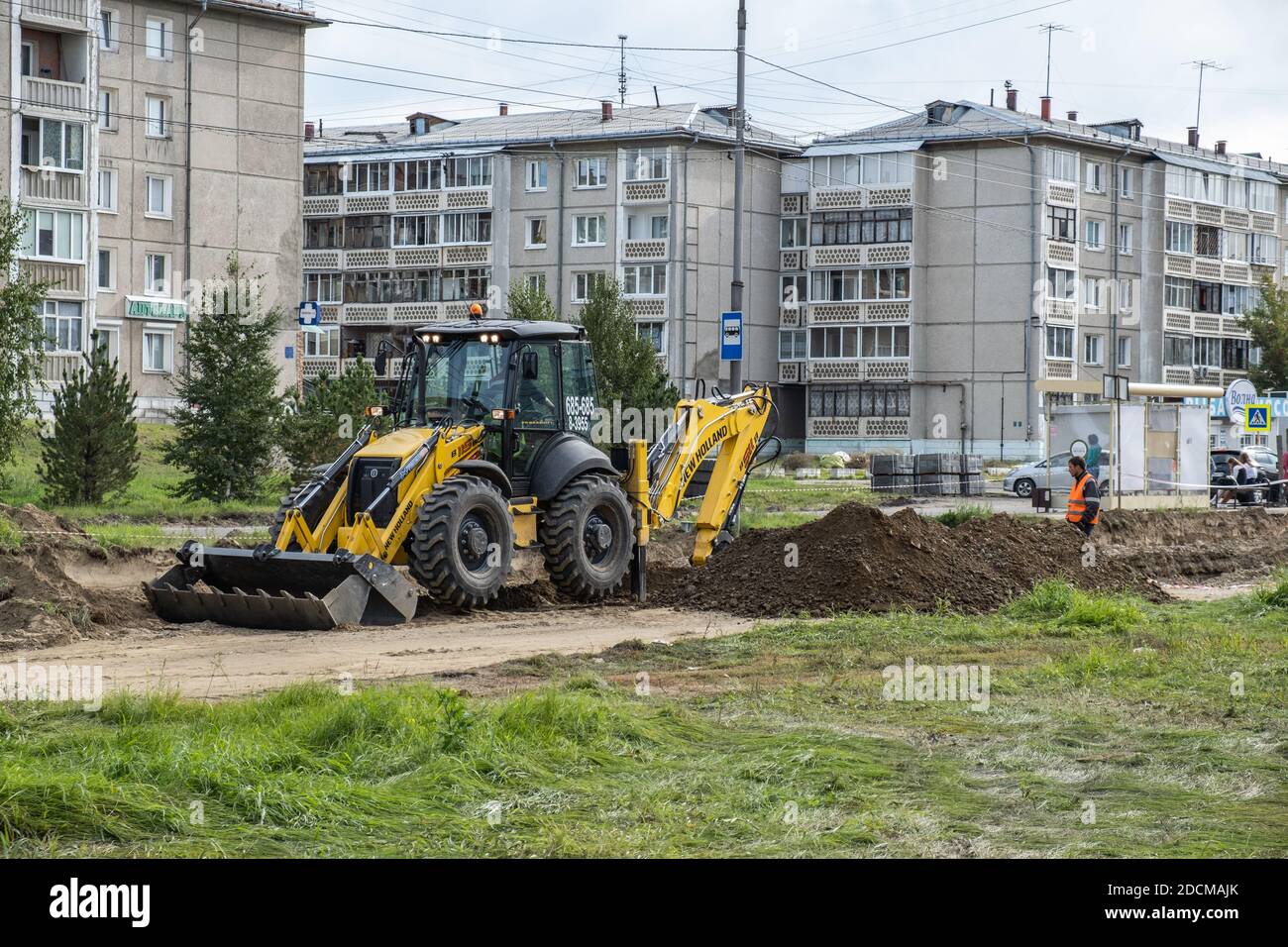 RUSSIA, ANGARSK - September 08, 2020 Construction, repair of a road in ...