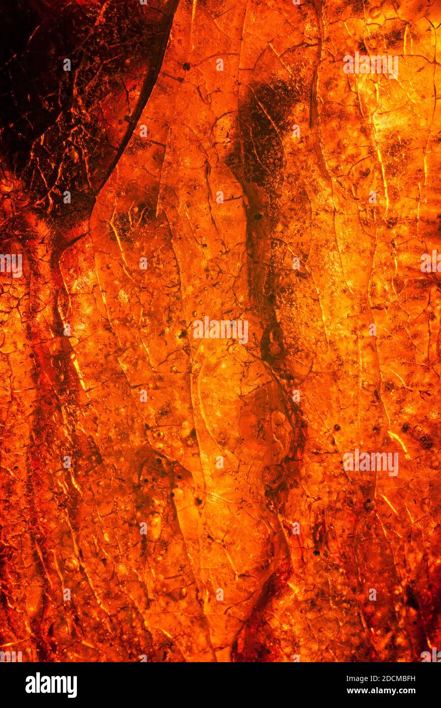 Texture background amber stone caramel macro close-up. Rough stone with ...