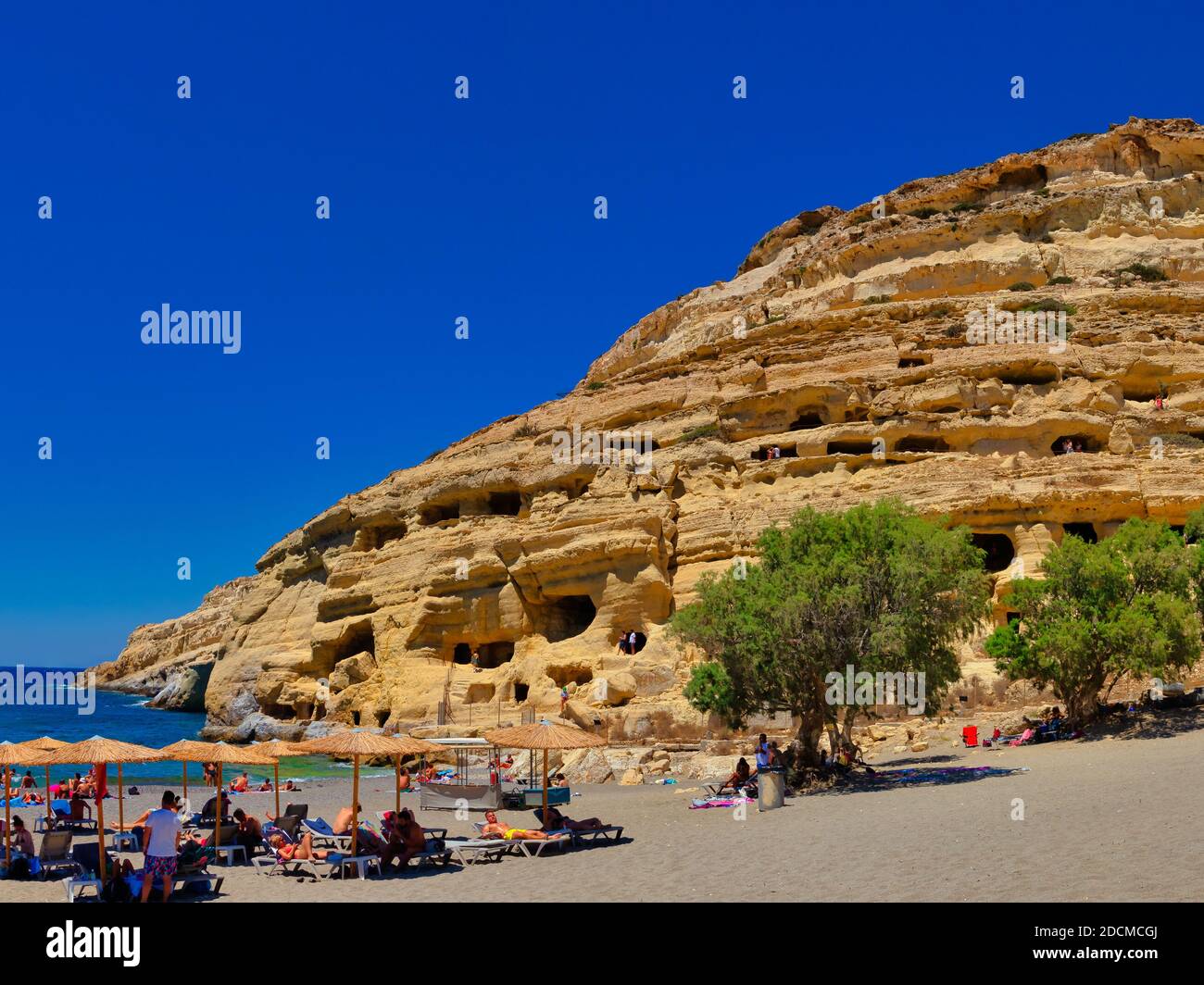 Matala, Greece - August 14, 2020 - Vacationers on the beach of Matala ...