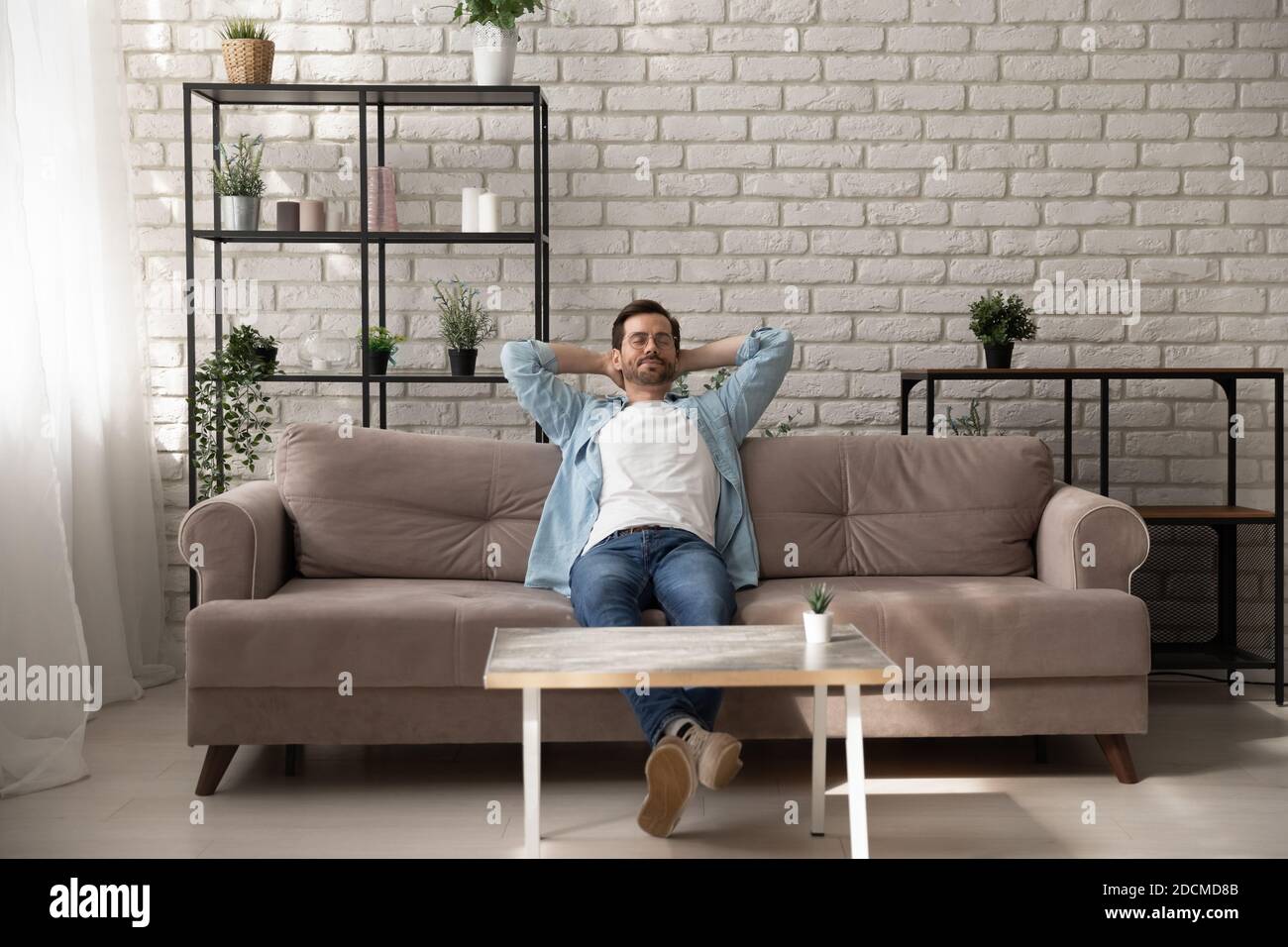 Man daydreaming couch hi-res stock photography and images - Alamy