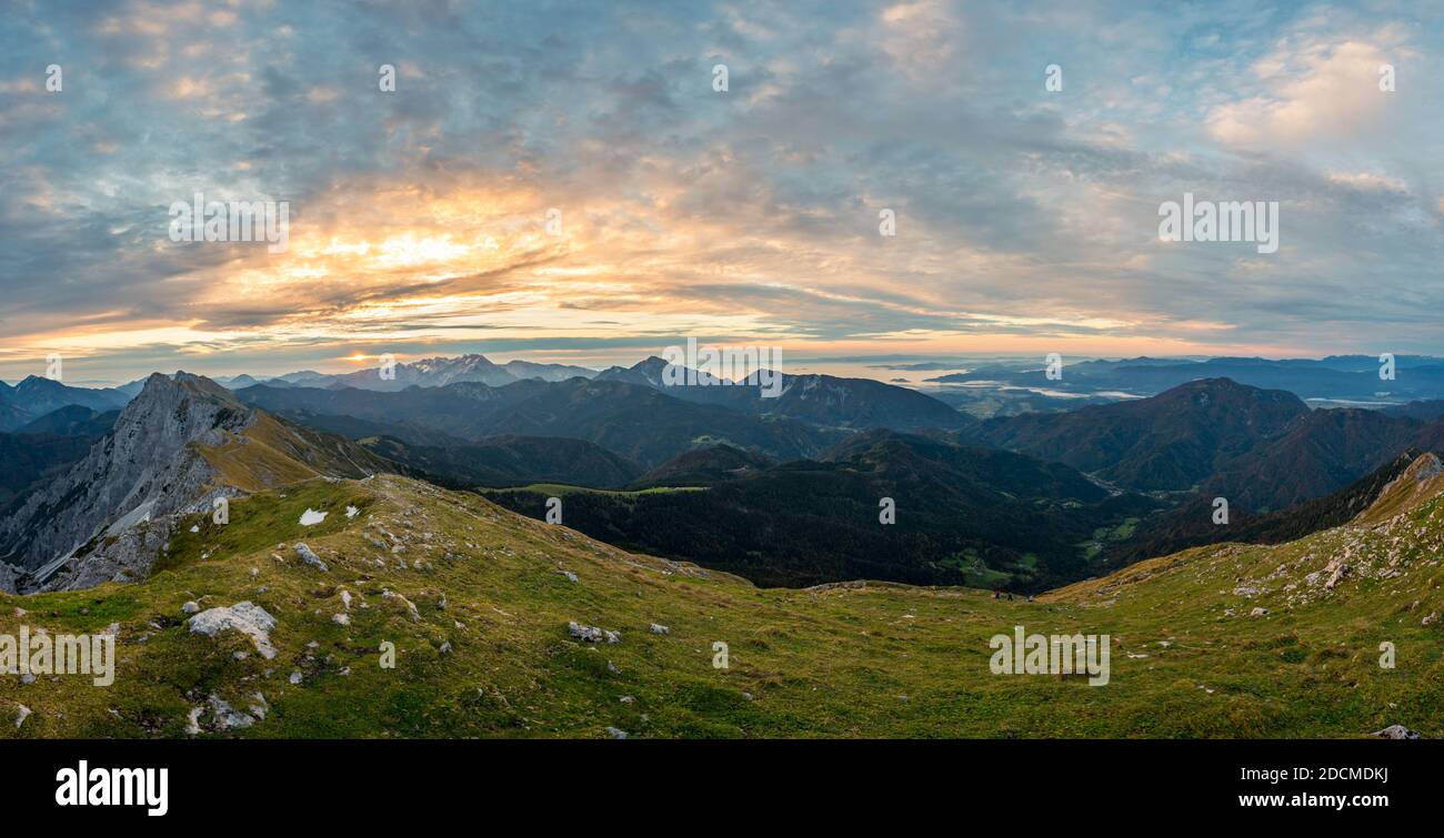 Spectacular mountain view of sun rising above high ridge in the ...