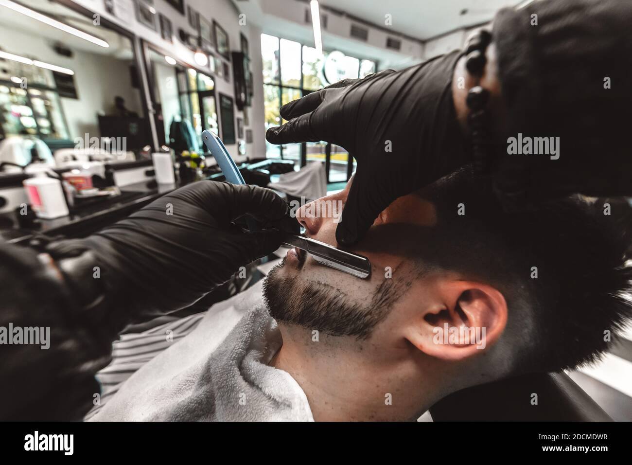 Shaving a beard in a barbershop from the first person Stock Photo - Alamy
