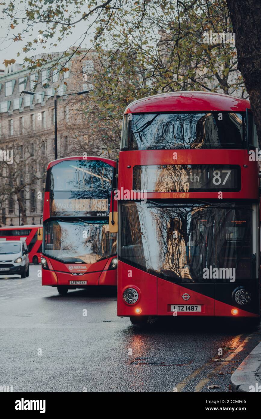 London, UK - November 19, 2020: Row of modern red double decker buses ...