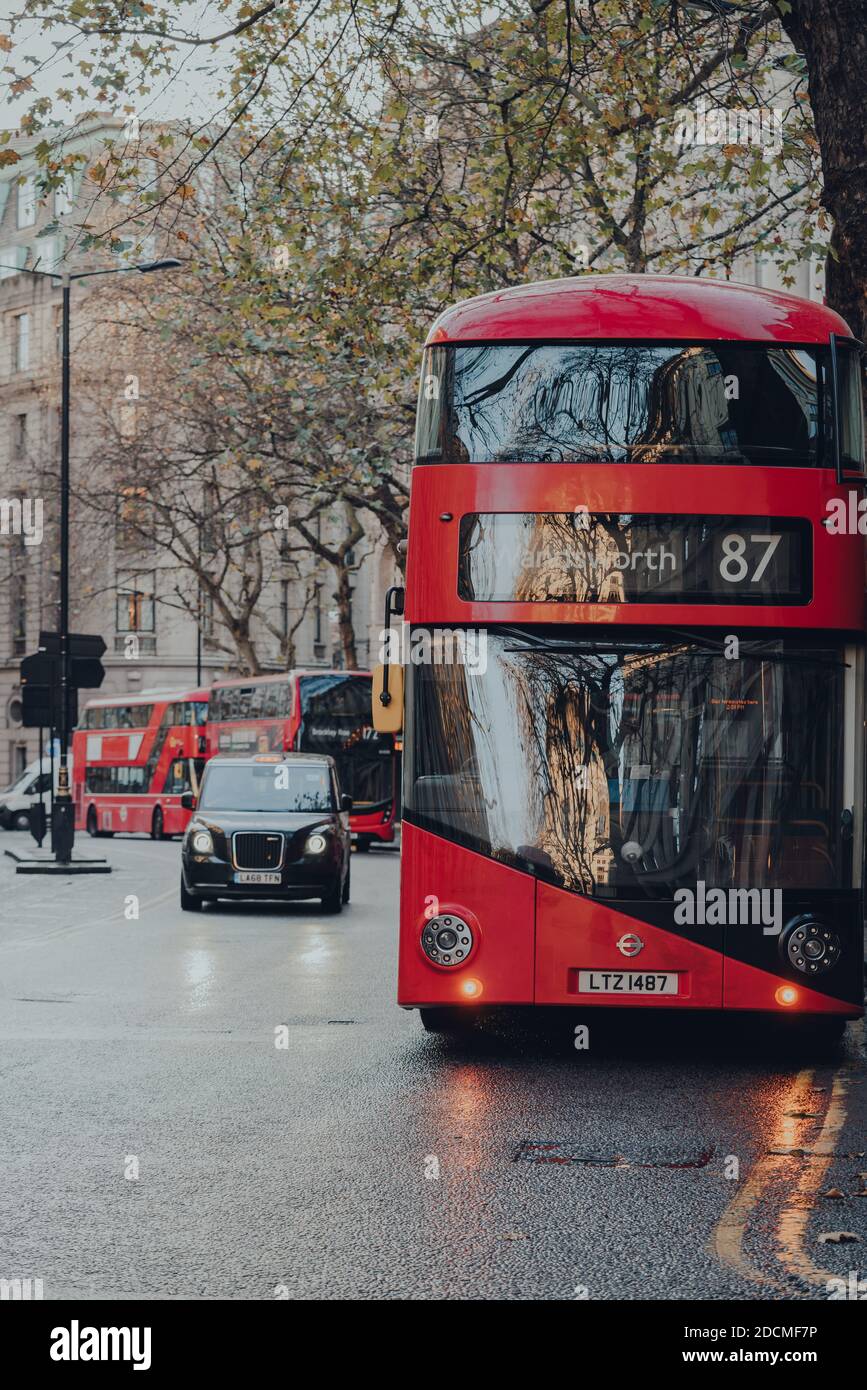 London, UK - November 19, 2020: Modern red double decker bus at a bus ...