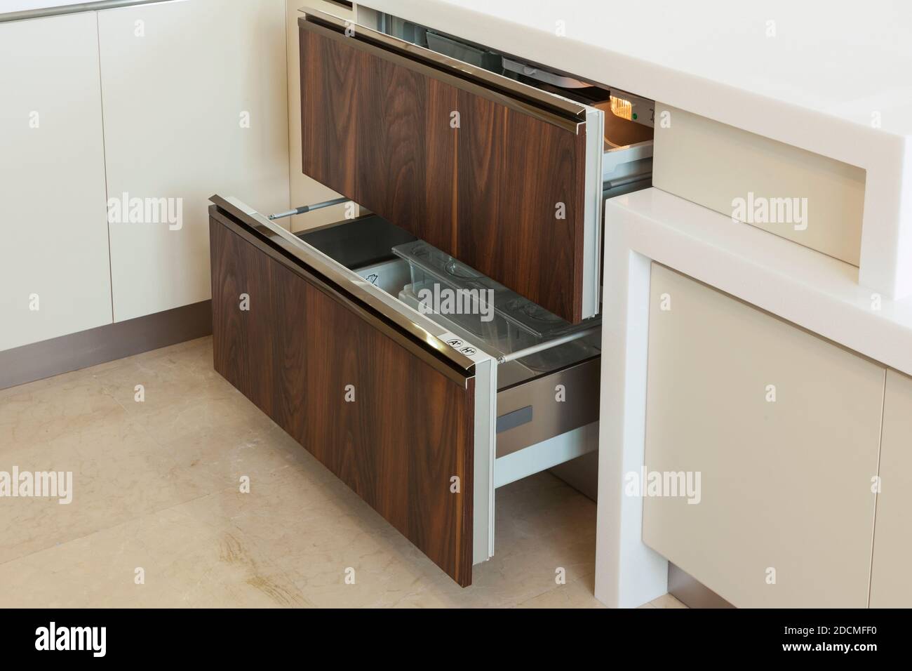 Modern kitchen, open wooden drawers with accessories inside, solution ...