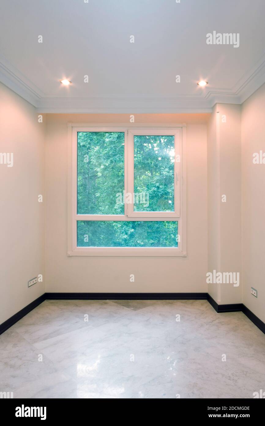 Empty room with window, parquet and wallpaper Stock Photo - Alamy