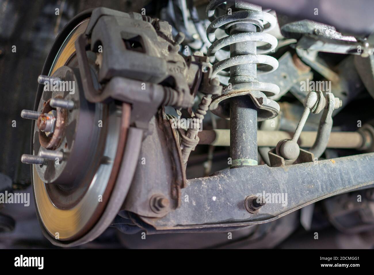 The hub of a wheel in a car service. Suspended car with no wheels ...