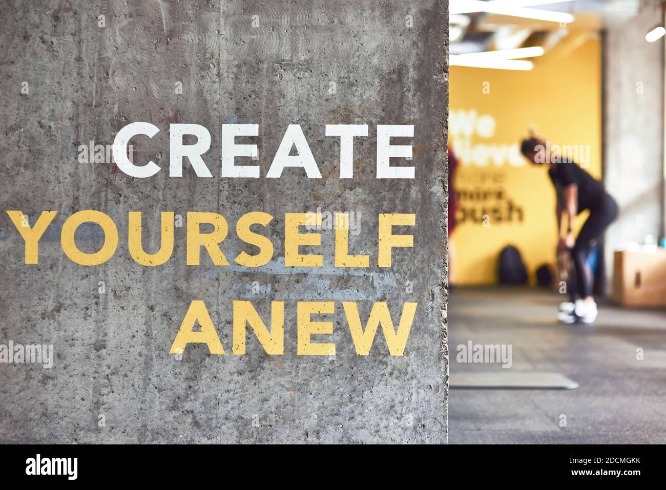 Fitness motivation quote Create Yourself Anew written on grey beton ...