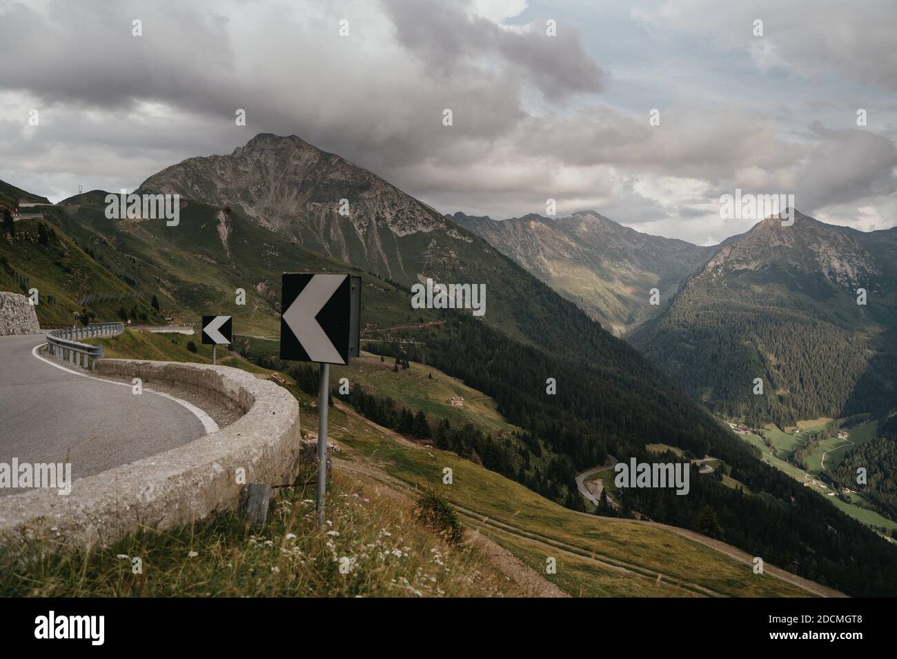 scenic mountain road with curve signs Stock Photo - Alamy