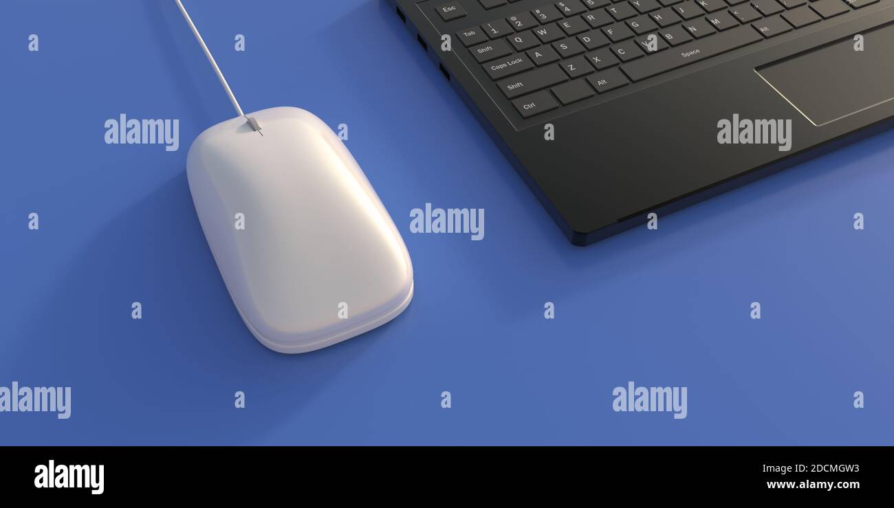 Computer mouse white color with cord and laptop on blue color ...