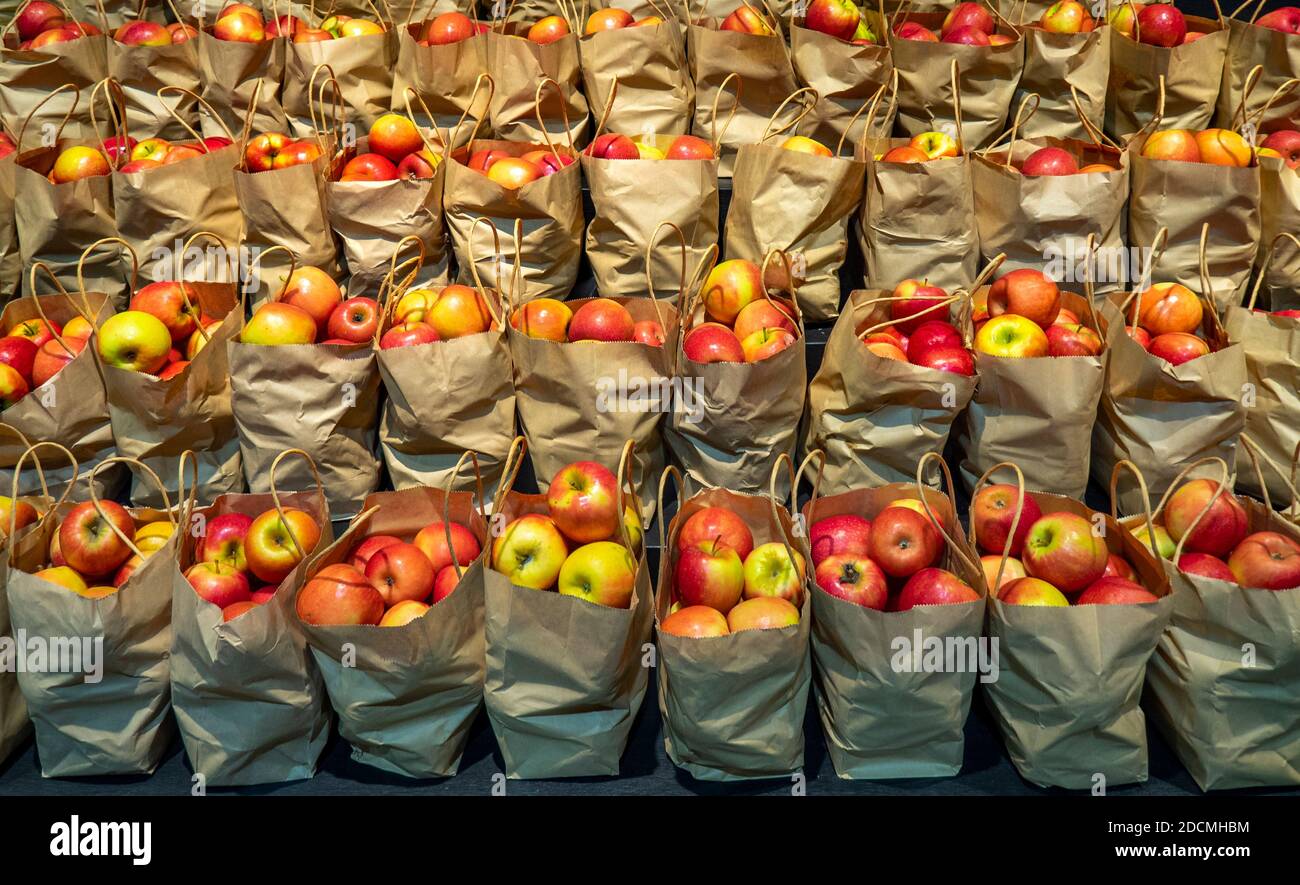 Display of pink lady apples prepacked in brown paper bags Stock Photo ...