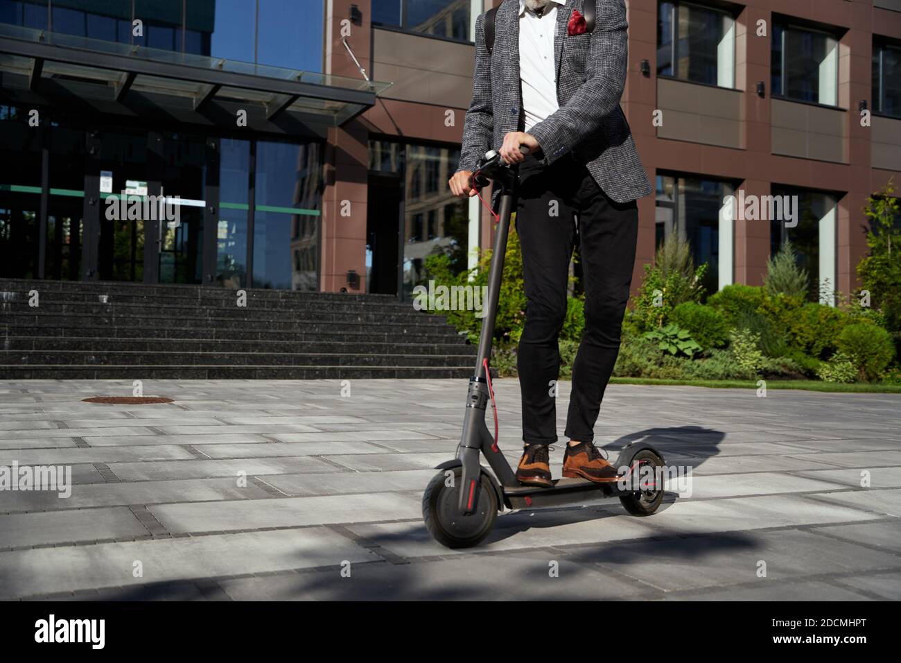 Eco vehicle. Cropped shot of elegant, stylish middle aged business man ...