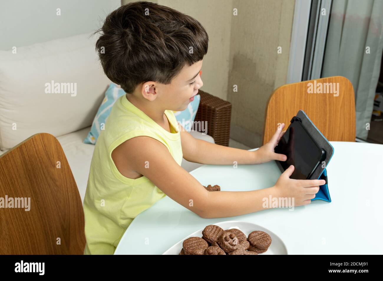 Child young boy eating bakery hi-res stock photography and images - Alamy
