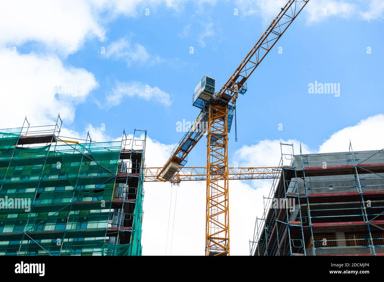 Construction site jib crane. Construction of new modern buildings ...