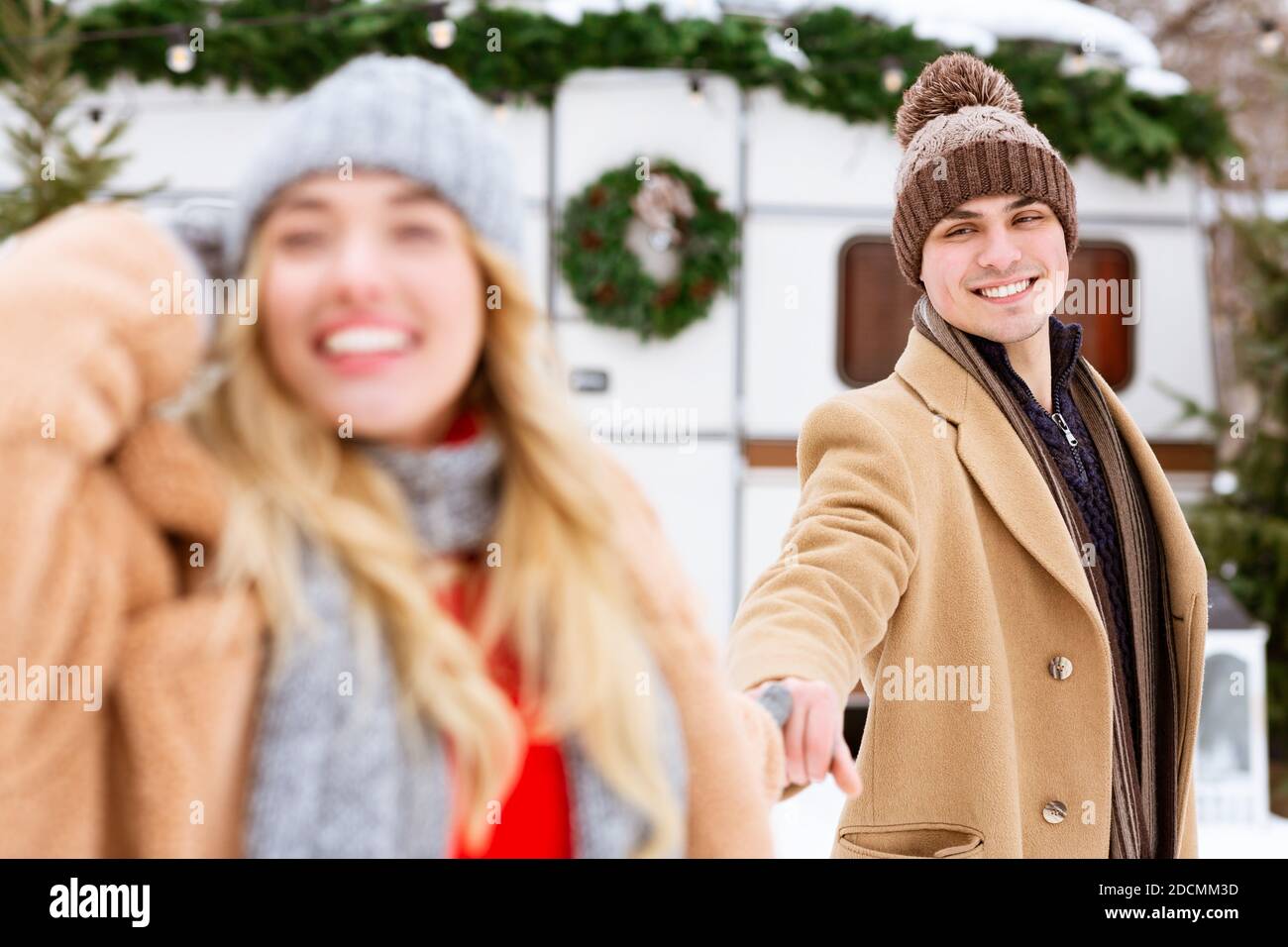 Romantic Couple Spending Winter Day Outdoors At Campsite, Loving Guy ...