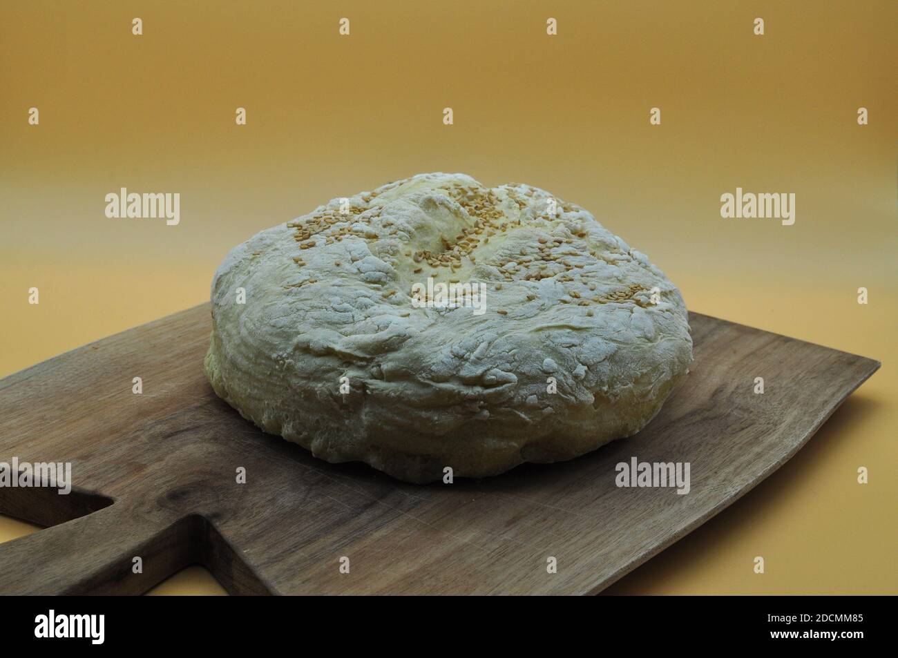 composition of a freshly baked handmade bread placed on an elegant ...
