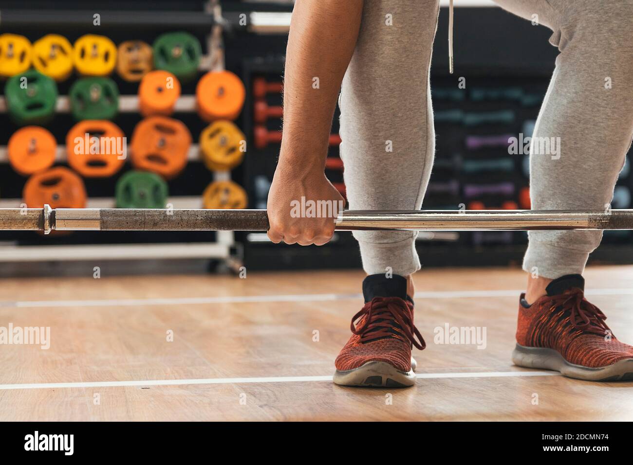 fitness boy lifting weights in the gym Stock Photo - Alamy