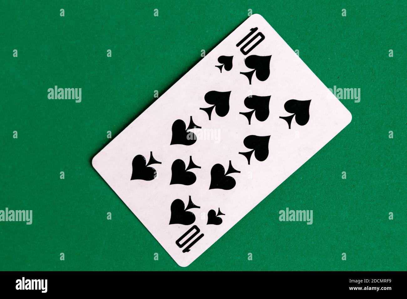 Ten of Spades playing card, green background Stock Photo - Alamy
