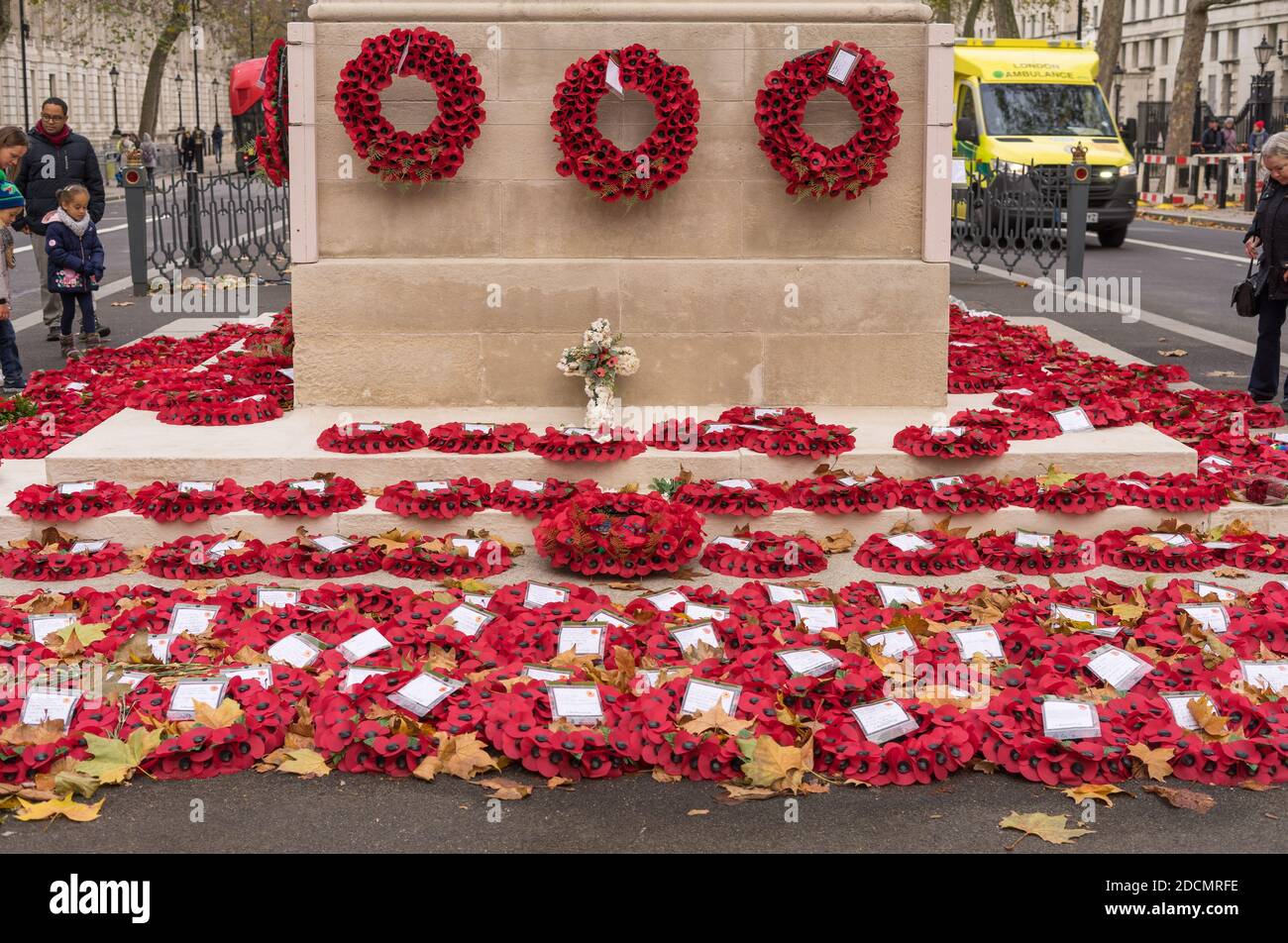 The Cenotaph down Whitehall covered in poppy wreaths and people paying ...