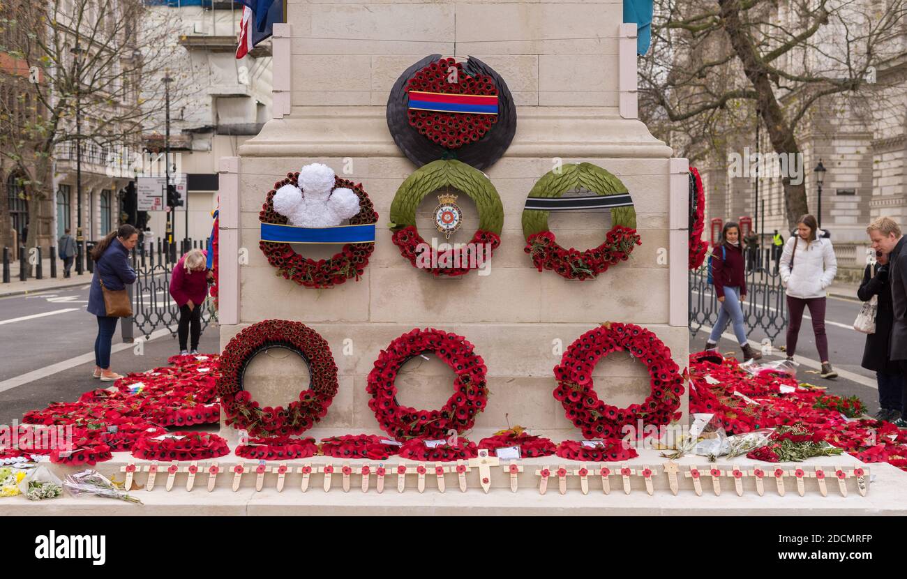 The Cenotaph down Whitehall covered in poppy wreaths and people paying ...