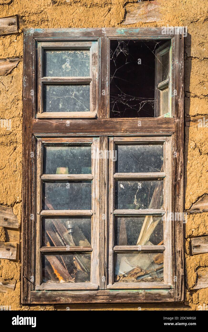 A pile of chopped wood, rusty window Stock Photo - Alamy