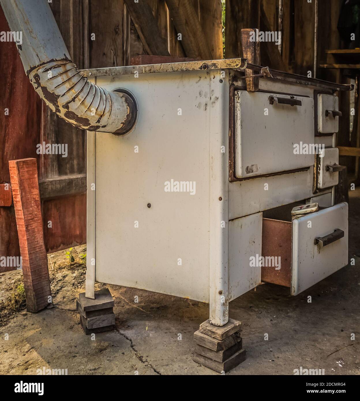 An old stove in the yard. Bake. Old furnace Stock Photo - Alamy