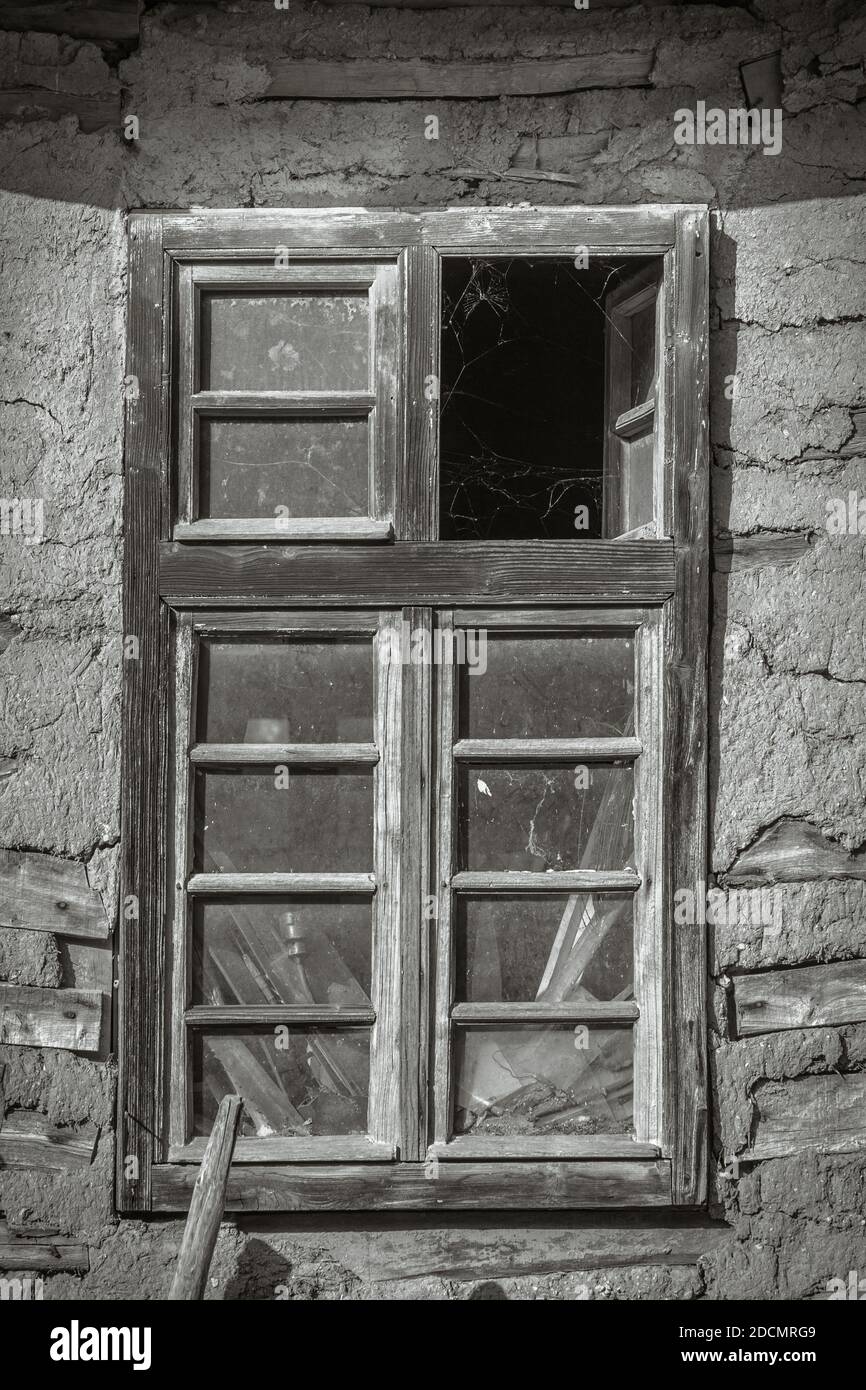 Old mud house, rusty window, black and white effect Stock Photo - Alamy