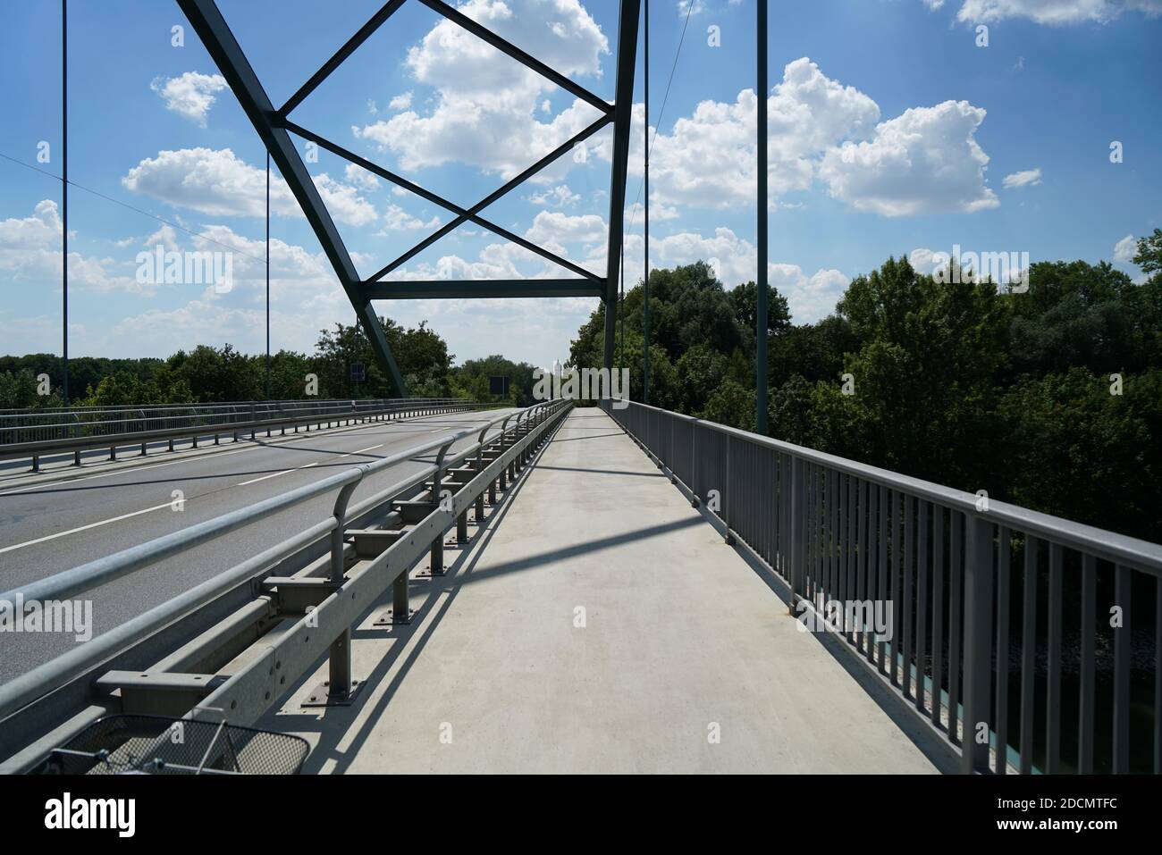 A view of a separate pathway for pedestrians on the bridge in the city ...