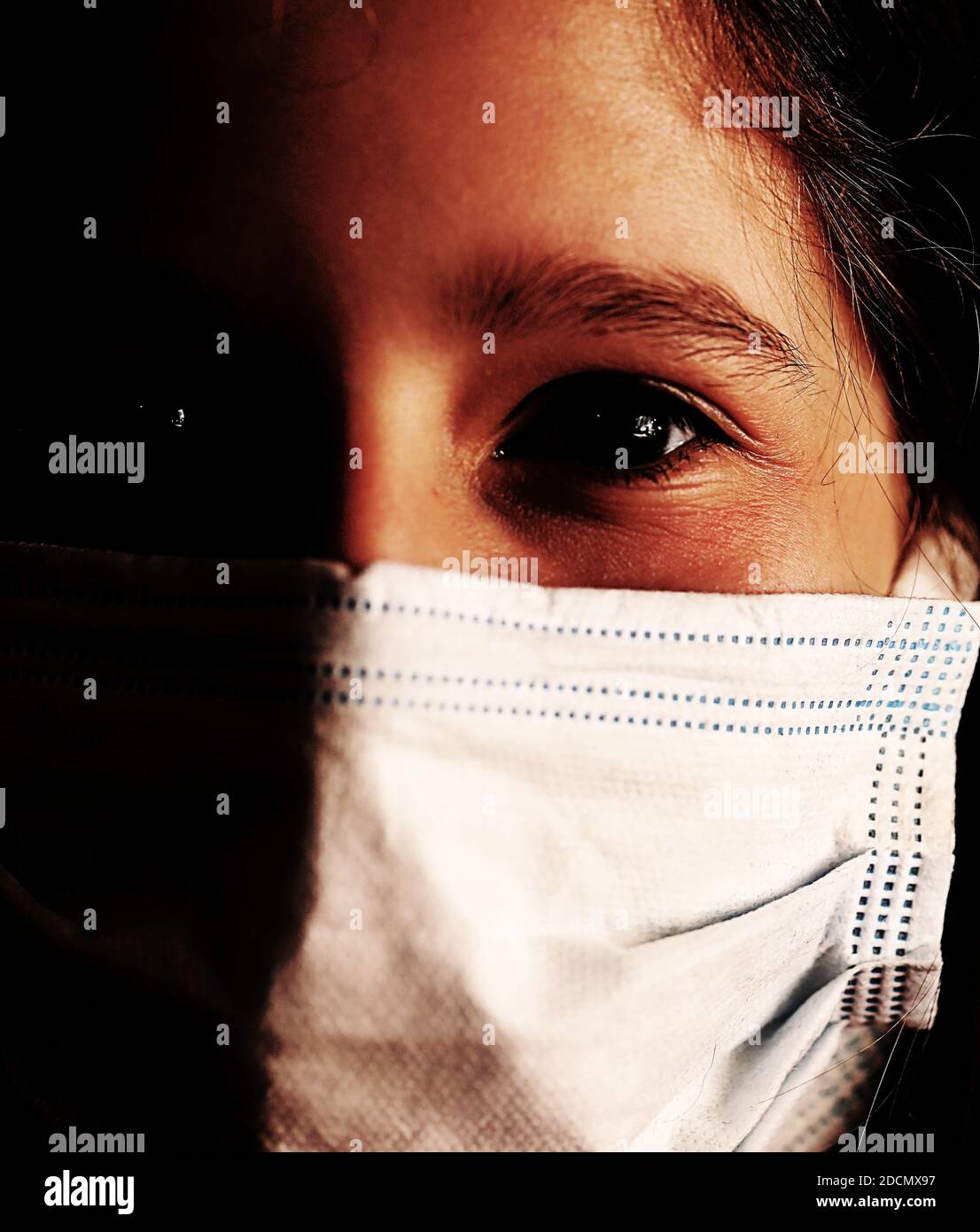 young girl with surgical mask with a very dramatic effect Stock Photo ...