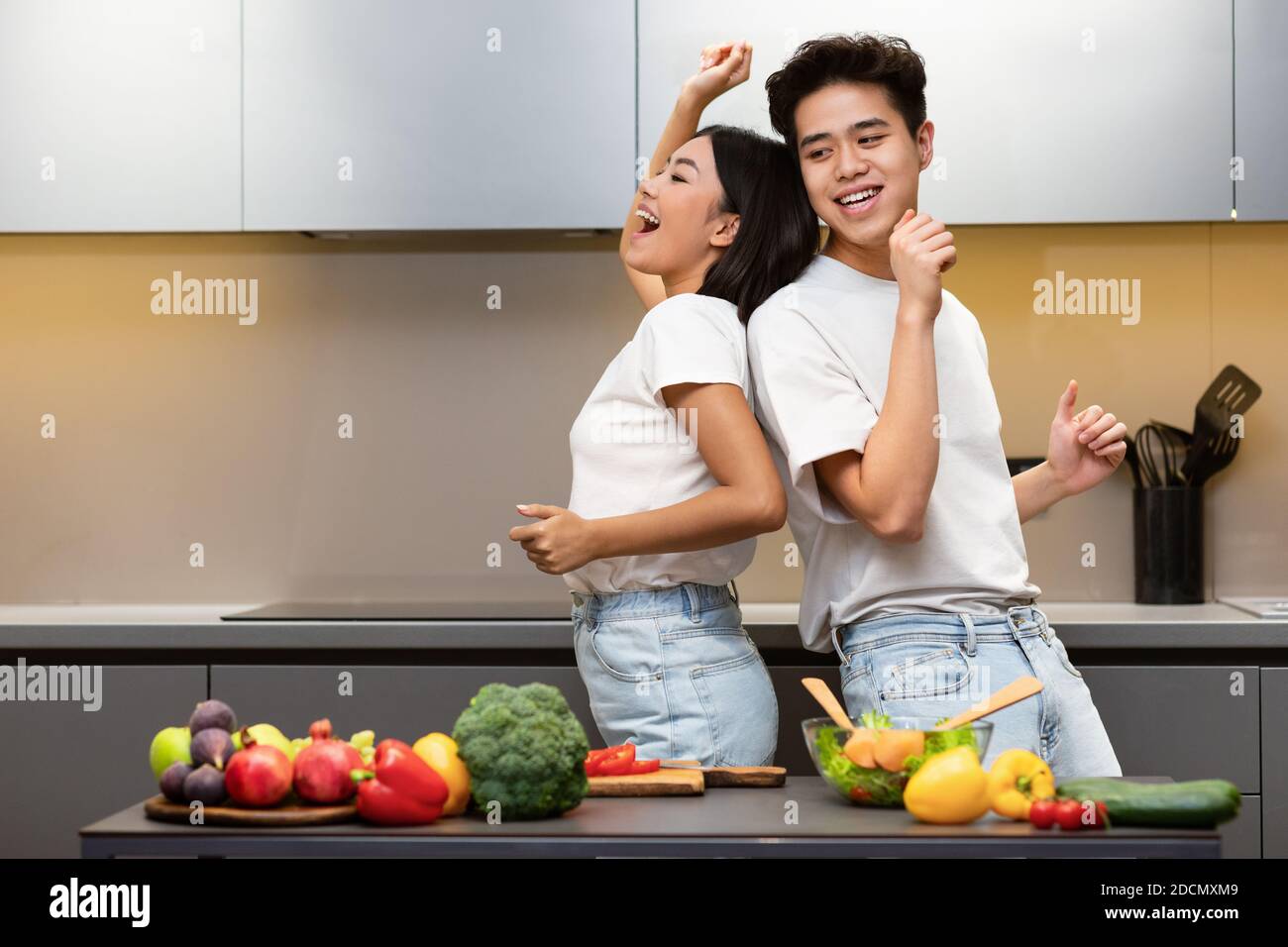 Woman dancing in kitchen hi-res stock photography and images - Alamy