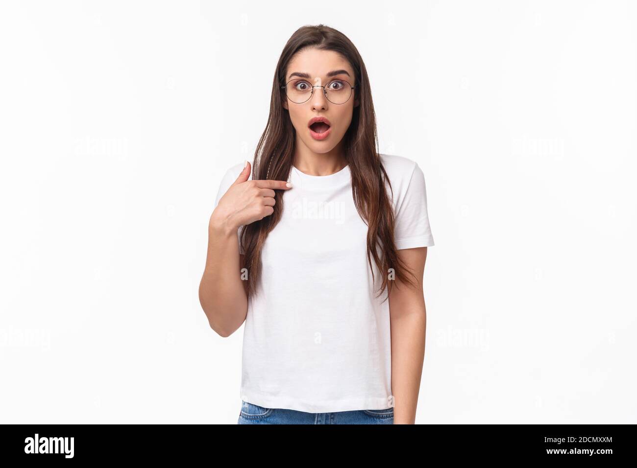 Portrait of surprised, startled young brunette female 20s in glasses ...