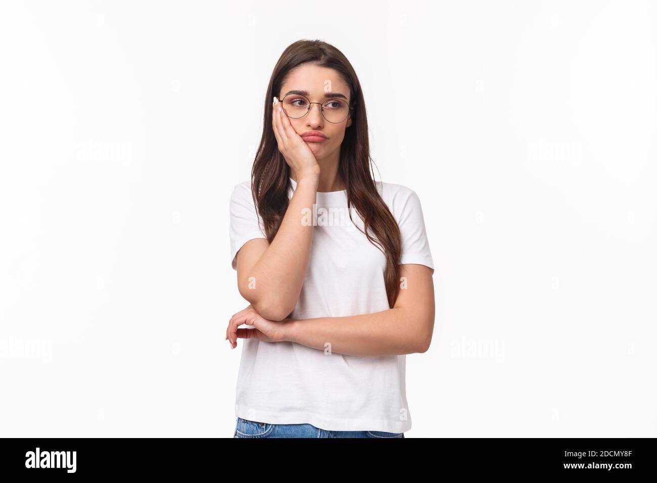 Portrait of bored and uninterested young reluctant girl, listening to ...