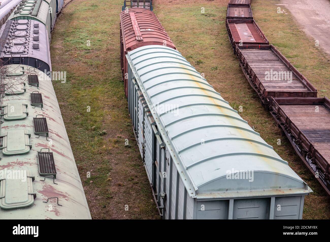 Platform and covered wagons. Several railway tracks. Logistics ...