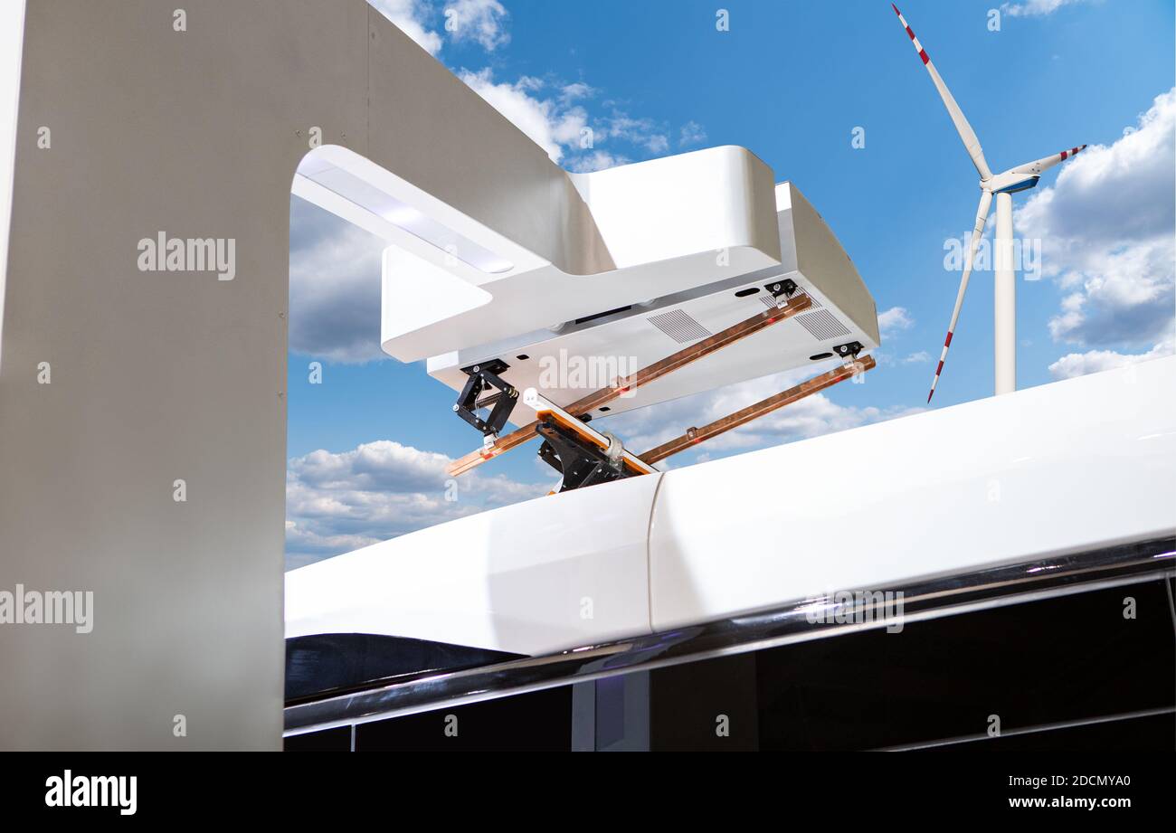 Electric bus at a stop is charged by pantograph Stock Photo - Alamy