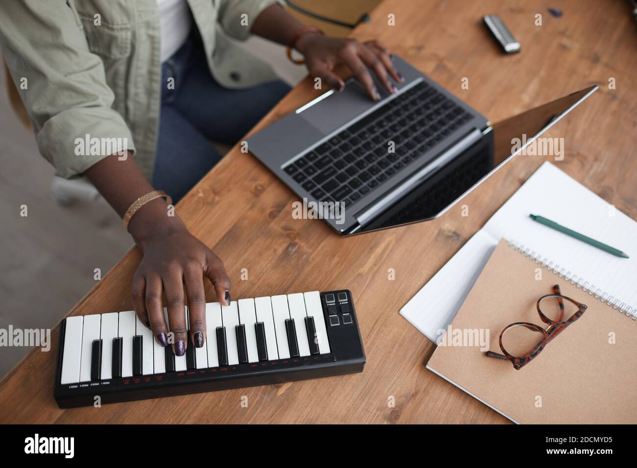 High angle close up of unrecognizable African-American woman composing ...