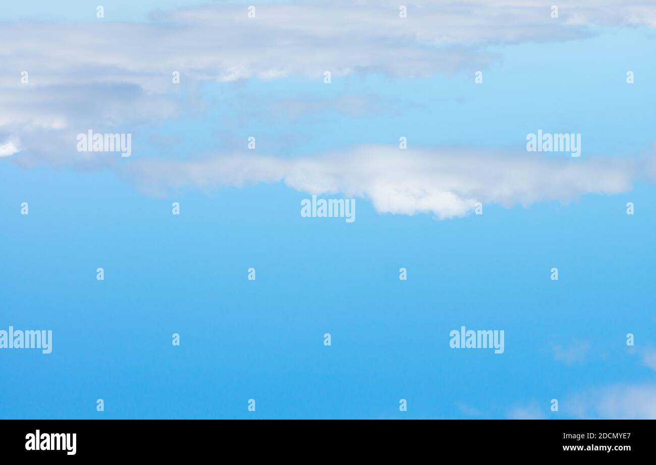 blue sky with flying white light clouds Stock Photo - Alamy