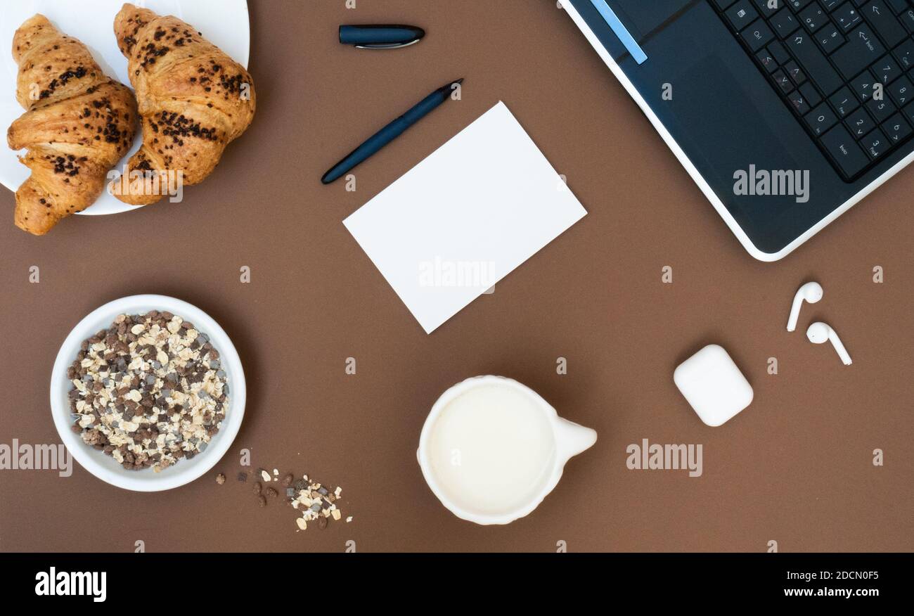 Business breakfast in office with coffee and croissant on white table ...