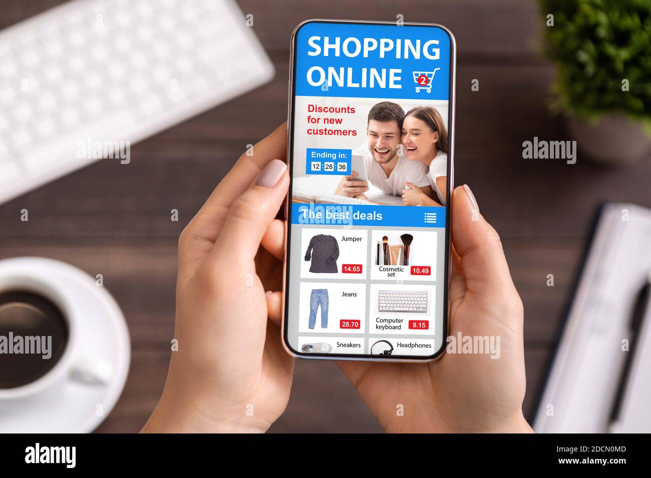Lady holding mobile phone using online shopping app sitting indoor ...