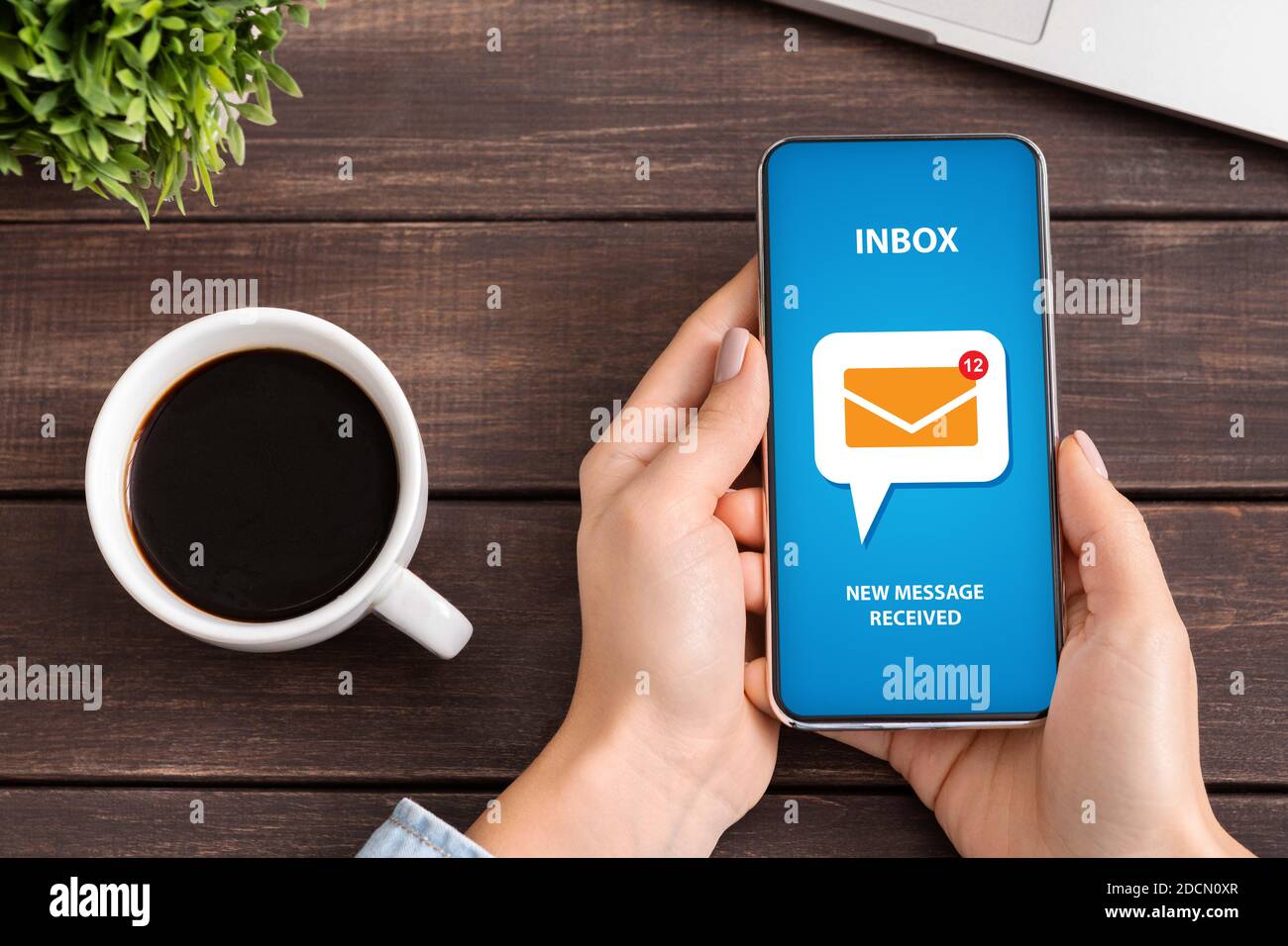 Flat lay of unrecognizable young woman checking her inbox for incoming ...