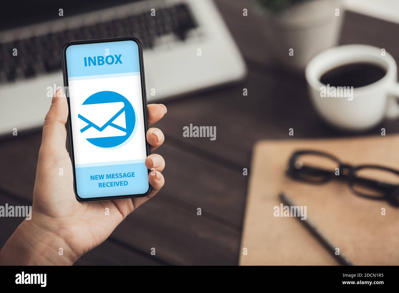 Collage with female hand showing cellphone with mail envelope and new ...