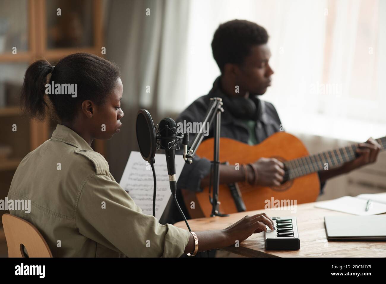 Female guitar sheet music hi-res stock photography and images - Alamy