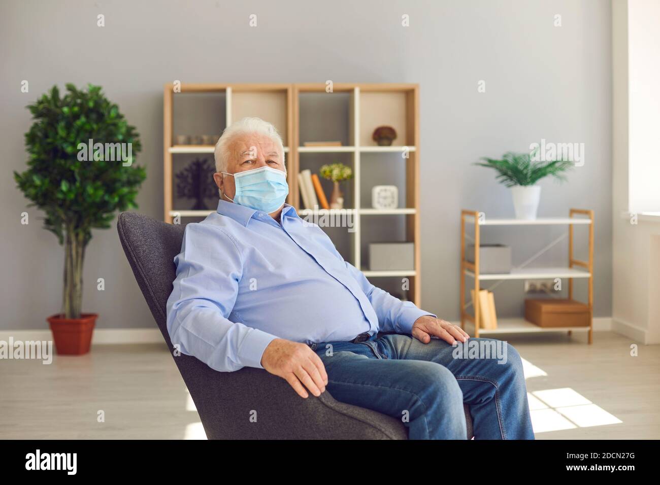 Senior man staying at home during lockdown and not going outside caring ...