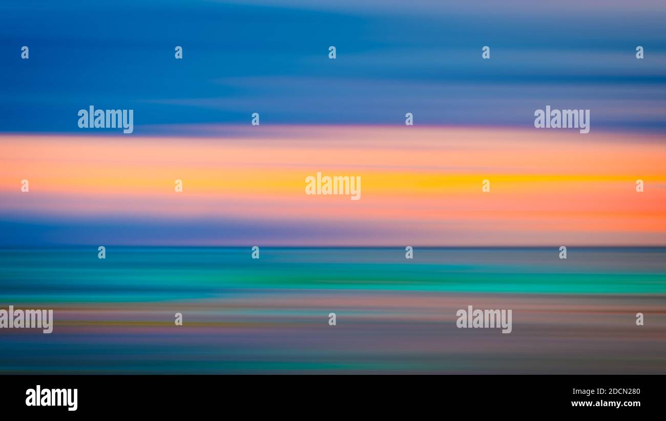 Vivid twilight sunset sky and motion blur of the sea under with long ...