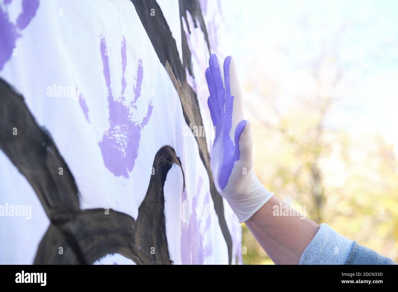 A hand painted purple participating in the International Day for the ...