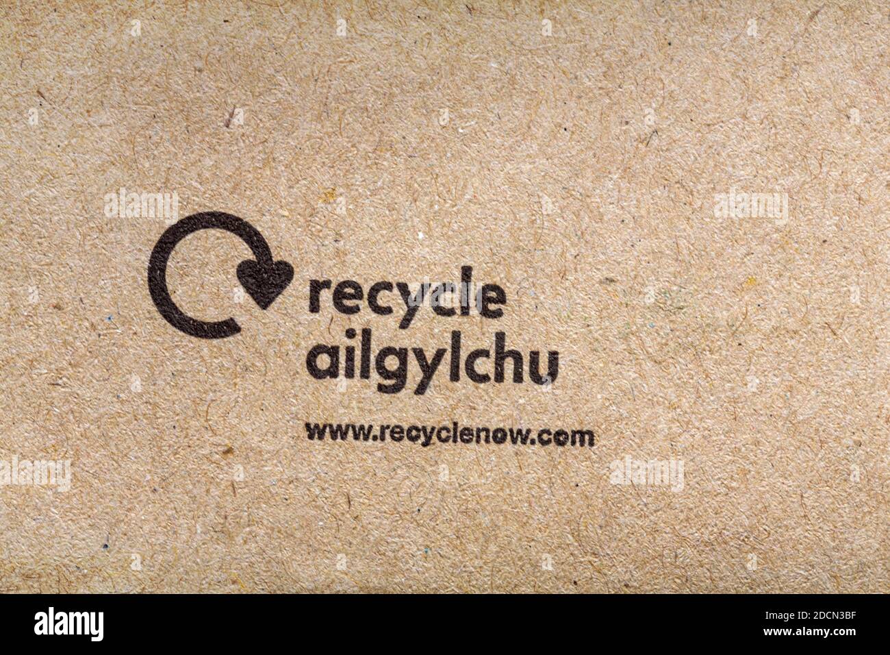 recycle logo symbol in Welsh and English on envelope on vehicle car tax ...